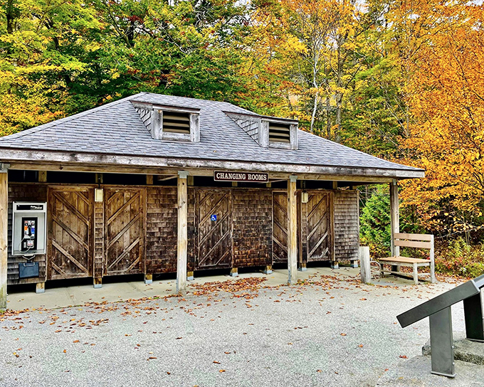 The rustic changing rooms stand as a charming reminder that some experiences are best enjoyed with minimal frills.