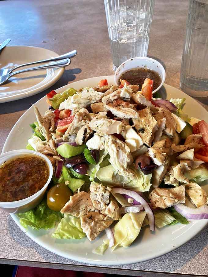 Greek Salad: A vibrant arrangement of crisp vegetables, olives, and feta that offers a refreshing counterpoint to pasta indulgence &ndash; virtue and vice on one plate.