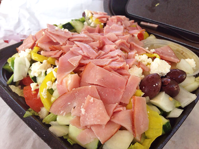 A Greek salad that doesn't skimp on the good stuff &ndash; loaded with ham, feta, and olives, it's the Mediterranean vacation your lunch break deserves.