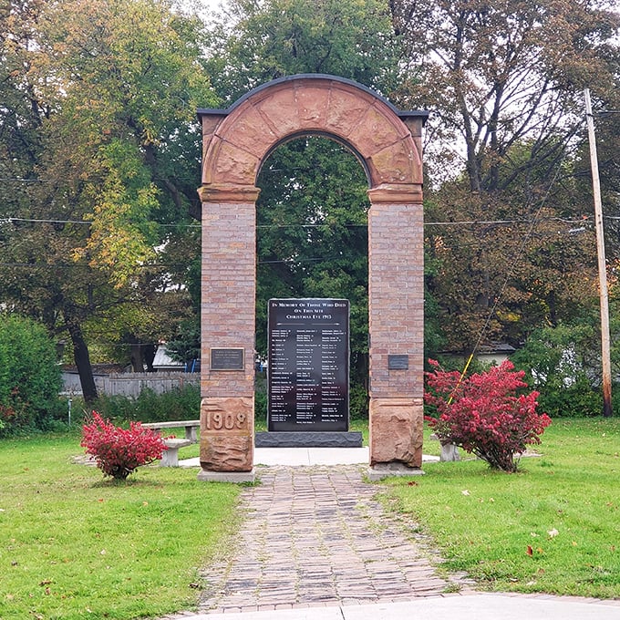 This 1909 memorial arch stands as a solemn sentinel, commemorating stories etched in stone and memory alike.