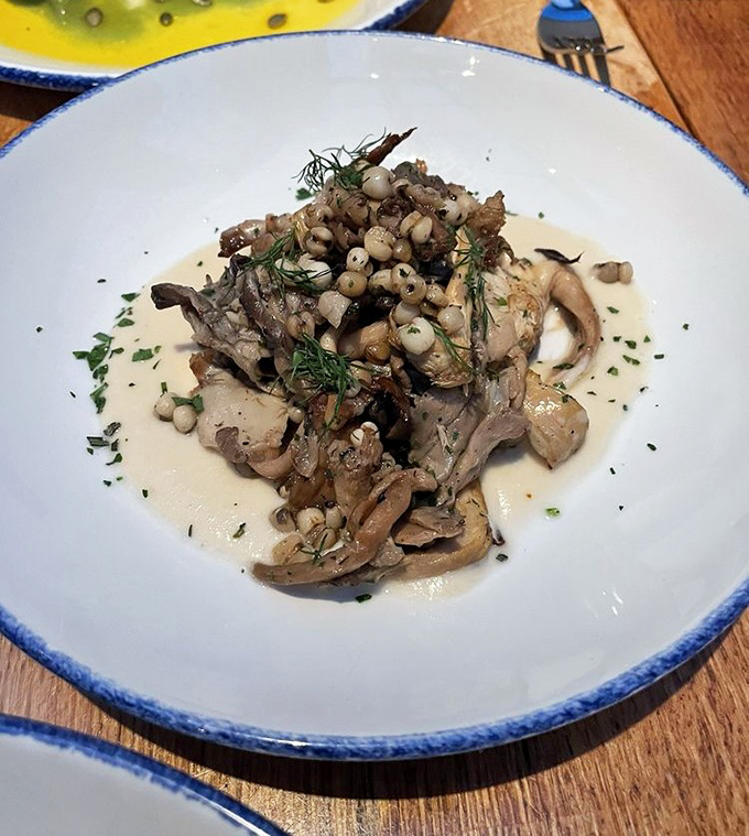 Wild mushrooms dance with herbs in a creamy sauce, creating an earthy symphony that might convert even the most dedicated fungi skeptics.