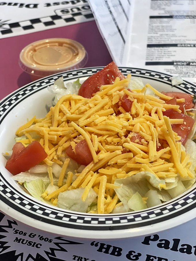 Even the simple house salad gets the Angel's treatment &ndash; crisp lettuce, fresh tomatoes, and a generous handful of shredded cheddar cheese.