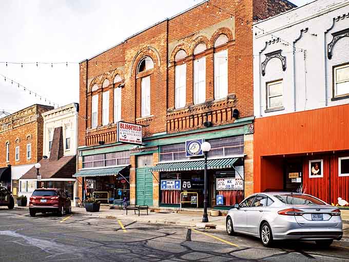 Classic storefronts with arched windows whisper tales of bygone eras while housing businesses that keep Blissfield's heart beating strong.