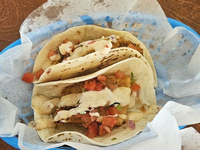 Walleye tacos: where Minnesota's favorite fish meets Mexican inspiration, creating a cross-cultural masterpiece topped with fresh pico de gallo.