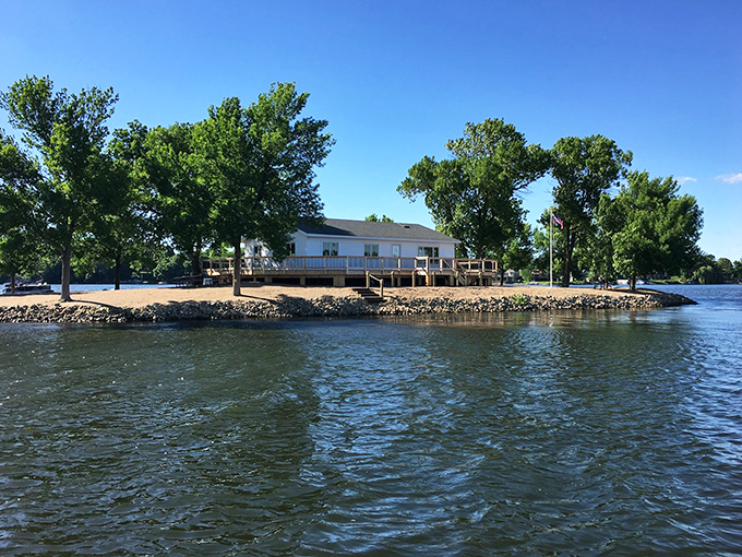 From the water, the island reveals its perfect proportions, a self-contained world of relaxation waiting to be explored.