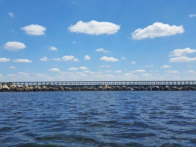 The wooden walkway stretches toward endless horizons, each step carrying you further from everyday worries into coastal serenity.