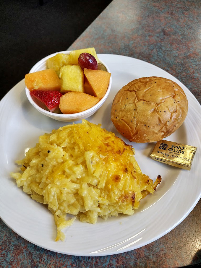 Breakfast done right: golden hash browns, fresh fruit, and a warm roll that puts ordinary breakfast spots to shame.