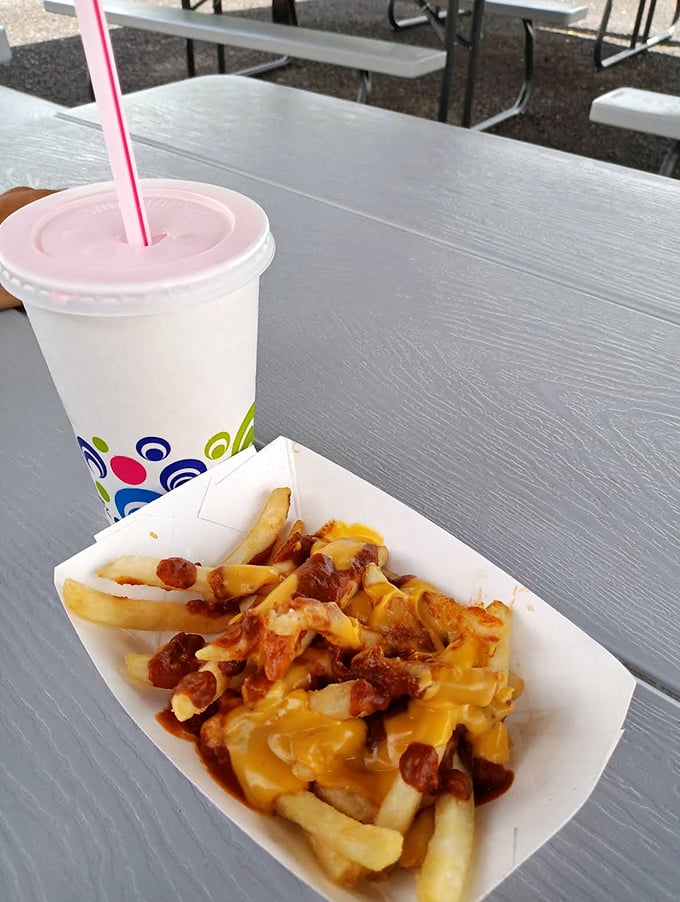Chili cheese fries that demand both hands and zero regrets – the savory prelude to your sweet caboose adventure.
