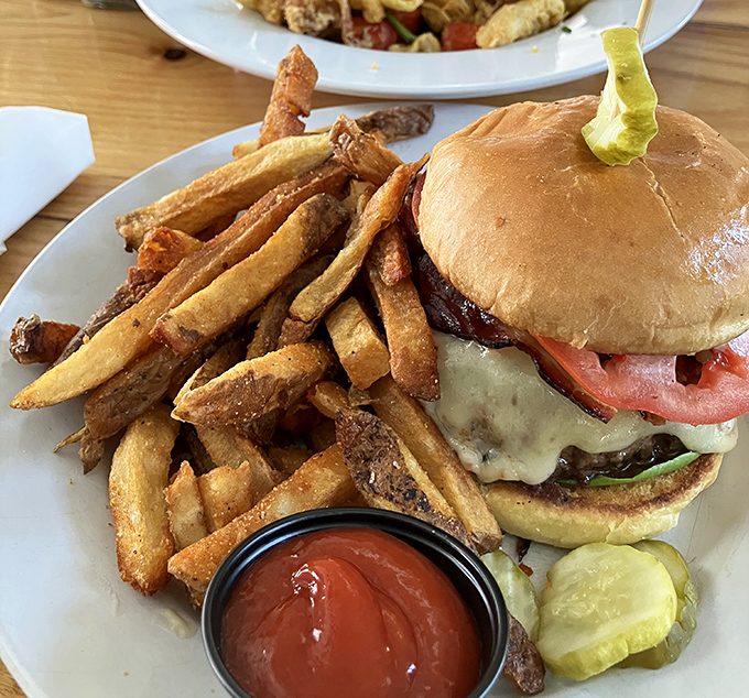 The White Duck Pub Burger arrives like a work of art &ndash; a perfectly seared patty, melty cheese, and fresh toppings on a brioche bun that's worth every bite.