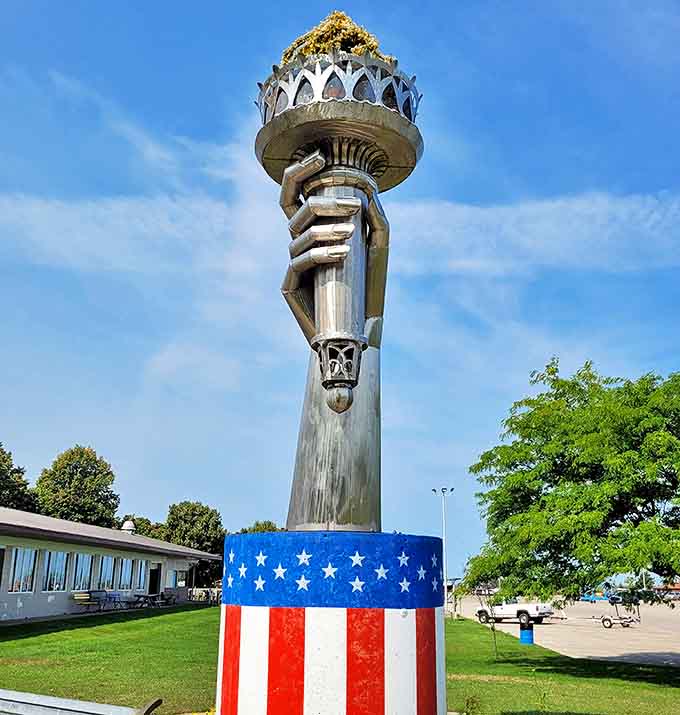 A patriotic monument stands tall in Rogers City, its unique design capturing attention against the backdrop of blue Michigan skies.