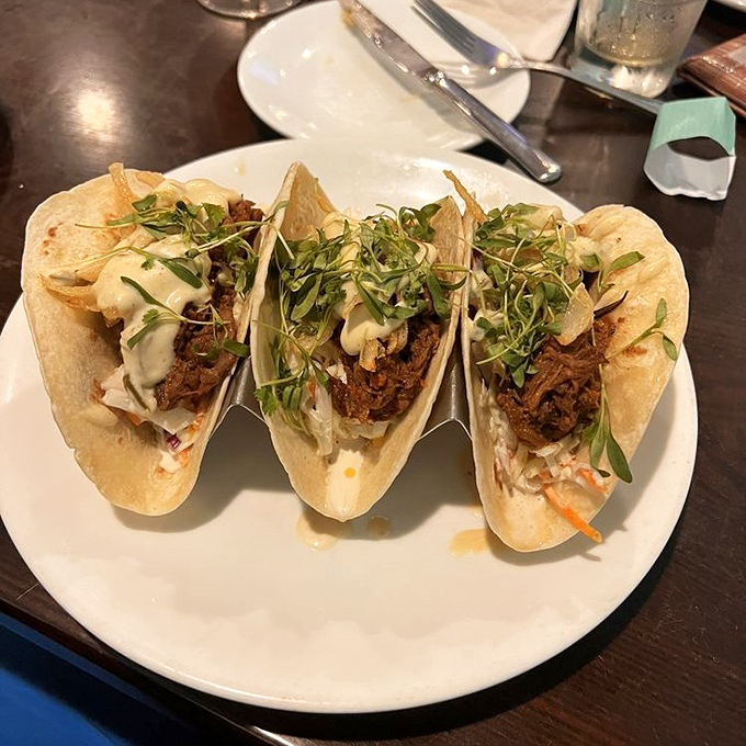Beef Short Rib Tacos: Soft tortillas cradle succulent beef and fresh toppings&mdash;proof that island cuisine isn't just about seafood.