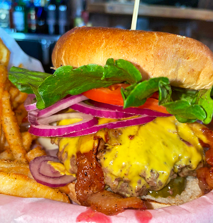 Cheese cascading over a perfectly cooked patty with vibrant toppings – this burger doesn't just satisfy hunger, it creates happiness.