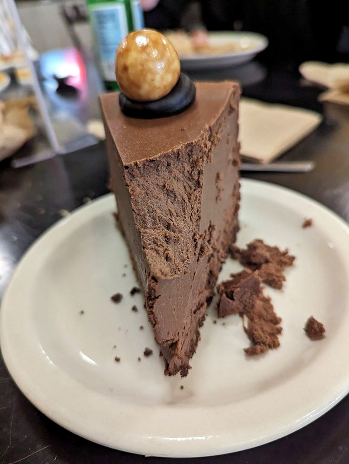 Chocolate malt cheesecake that defies gravity and willpower in equal measure. Dense, rich, and crowned with a hazelnut &ndash; dessert doesn't get more serious than this.