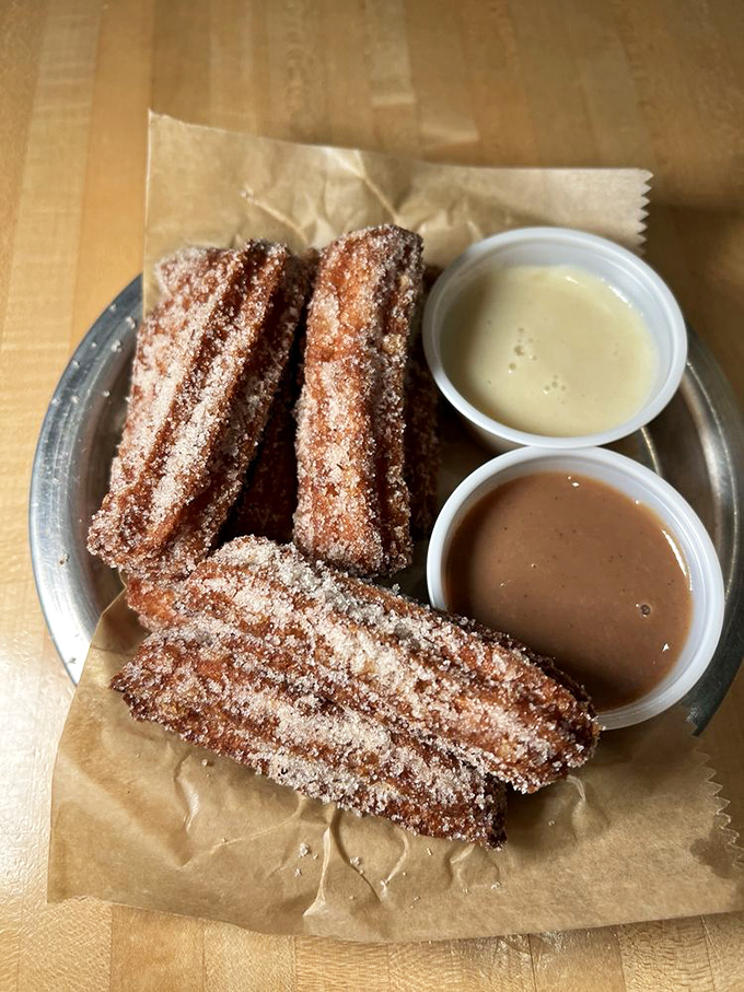 Churros that would make your abuela proud &ndash; crispy, cinnamon-sugar perfection with dipping sauces that demand to be savored slowly.