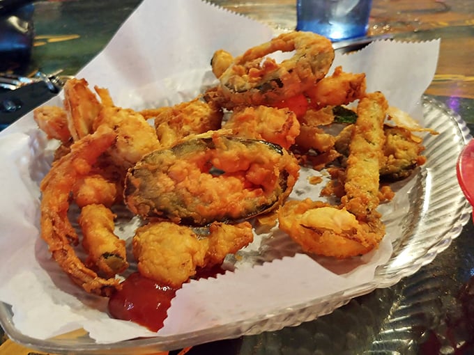 These golden-fried veggies prove that even landlubber food gets the royal treatment at Moorings &ndash; crispy, hot, and utterly irresistible.