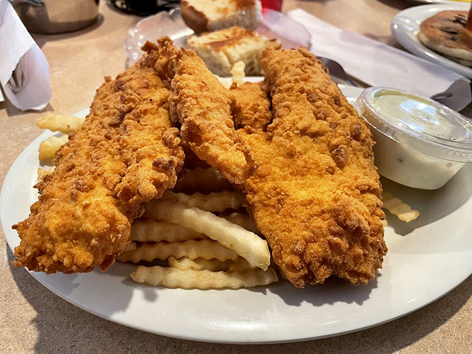 Fried chicken that achieves the impossible: crispy outside, juicy inside, and somehow both light and satisfying.