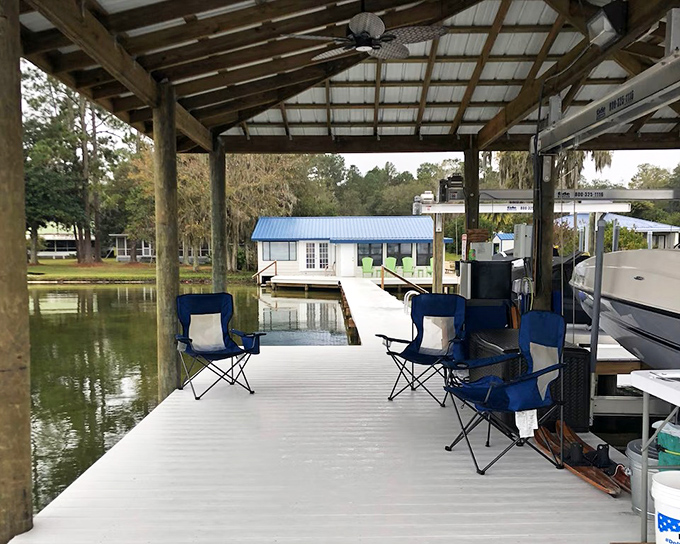 Morning light dances across the water's surface, turning a simple wooden walkway into a pathway to tranquility.