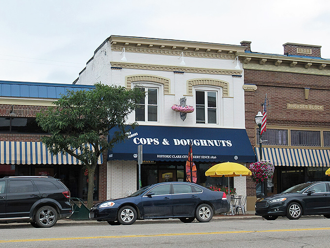 Clare's charming main street stretches into the distance, where hanging traffic lights and historic storefronts create a quintessential small-town atmosphere.