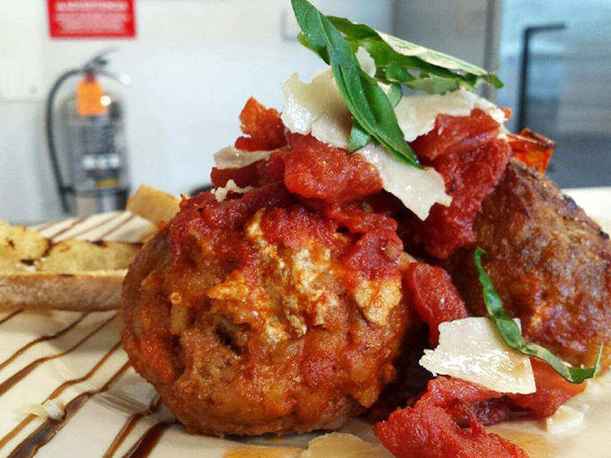 These aren't your average meatballs – tender, perfectly seasoned, and swimming in rich tomato sauce with fresh Parmesan and basil.