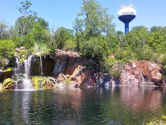 The Montello water tower peeks above the treeline, watching over falls that transform an industrial past into natural splendor.