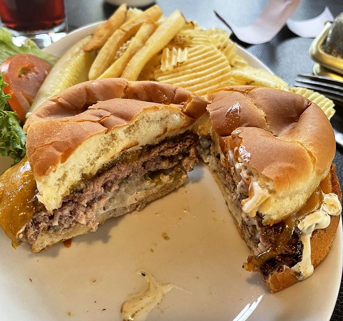 This burger means business with its thick patty and toasted bun, the kind that requires strategic planning and extra napkins.