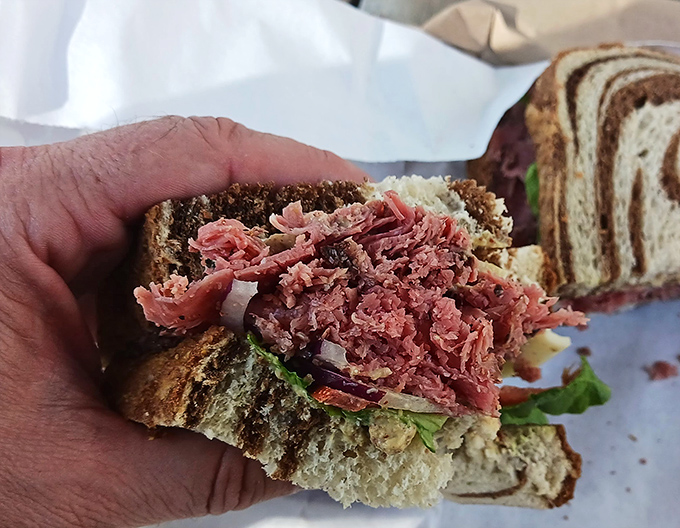 Pastrami with personality: Thick-cut, peppery, and piled sky-high&mdash;this isn't just a sandwich, it's a monument to deli greatness that demands respect.