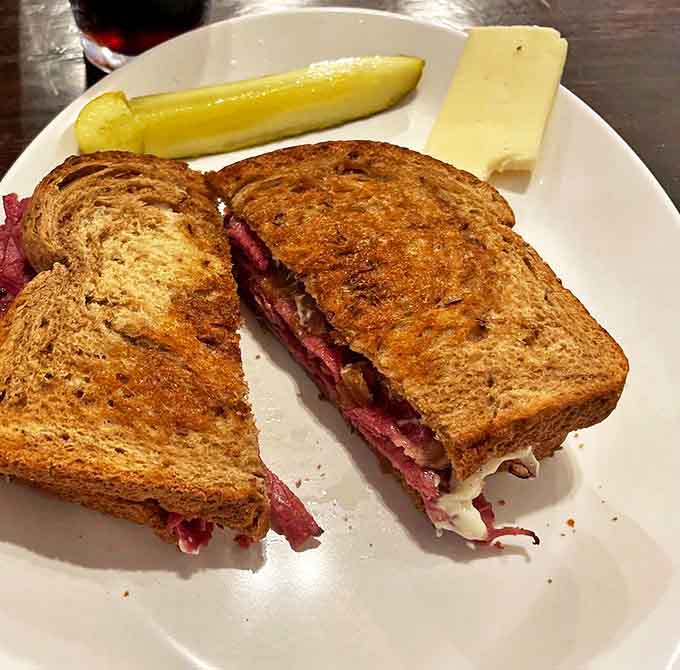 The pastrami sandwich arrives like a delicious tower of meat and melted cheese &ndash; a monument to the art of sandwich craftsmanship.