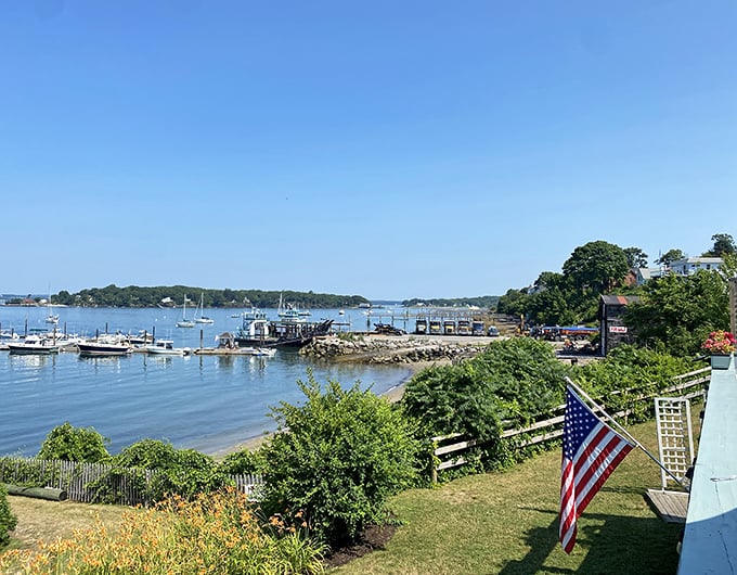 Peaks Island's harbor view captures quintessential Maine &ndash; tranquil waters, working docks, and the Stars and Stripes fluttering in the Atlantic breeze.