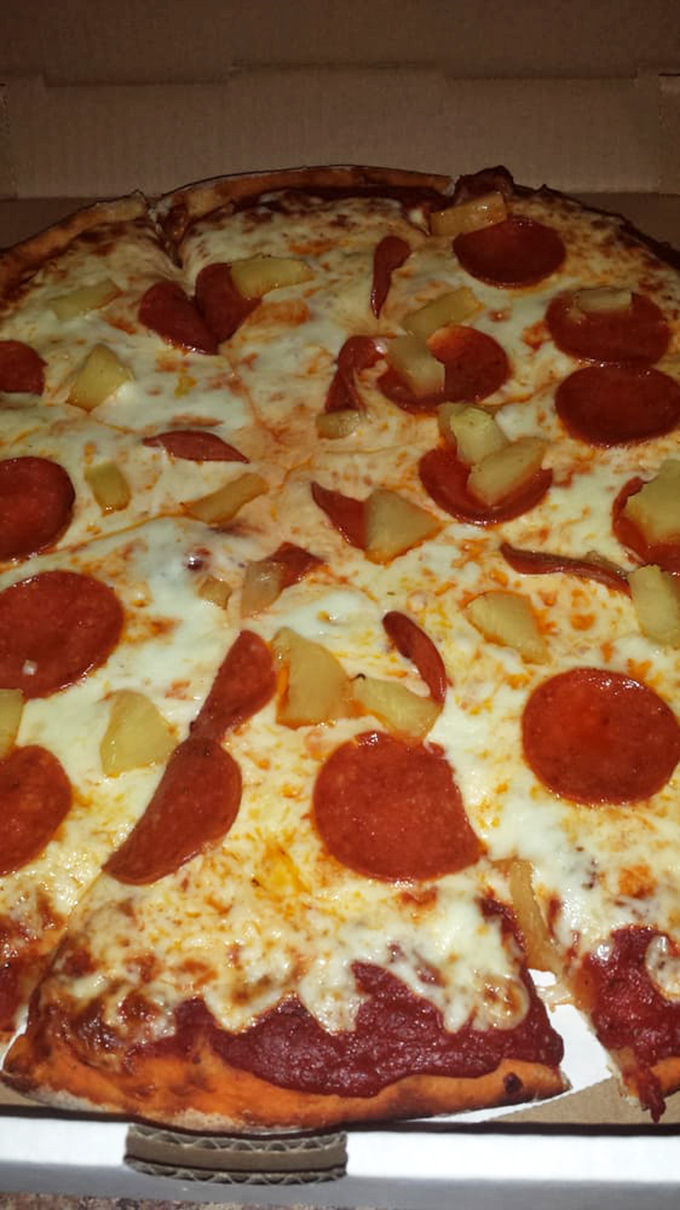 Pizza perfection with pepperoni and pineapple &ndash; proving that Lawry's mastery extends beyond their famous pasties to other comfort food classics.