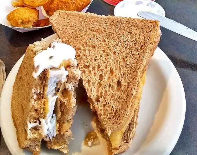 The perch sandwich on rye bread shows how traditional Wisconsin flavors come together in unexpected, delicious ways.