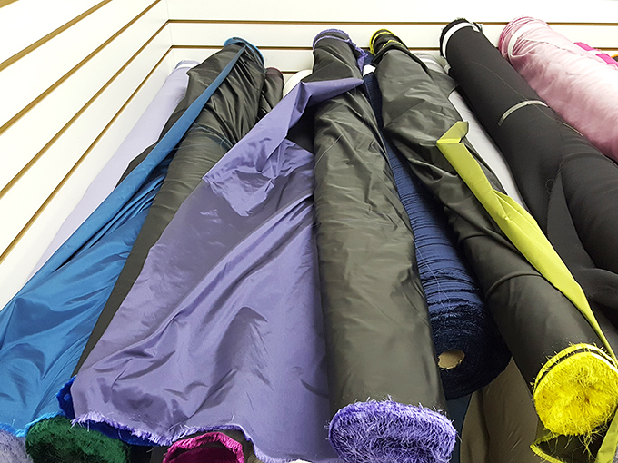 Luxurious satins and silks catch the light, their smooth surfaces promising elegance for special occasion projects without the designer price tag.