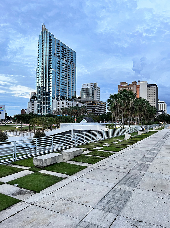 The checkerboard grass pattern brings a touch of Alice in Wonderland whimsy to Tampa's urban landscape. Perfect for impromptu chess matches or picnics.