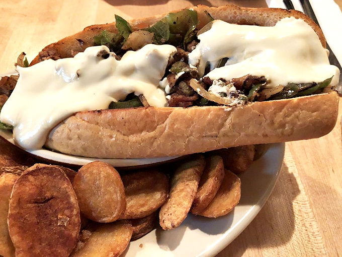 A sandwich that requires both hands and possibly a nap afterward &ndash; meat and cheese in perfect, messy harmony.