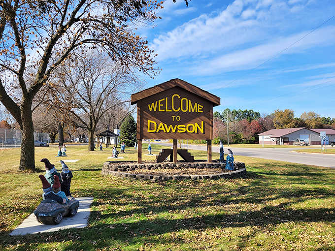 Dawson's welcome sign and its gnome guardians stand ready to greet visitors &ndash; the red hats popping cheerfully against any backdrop.