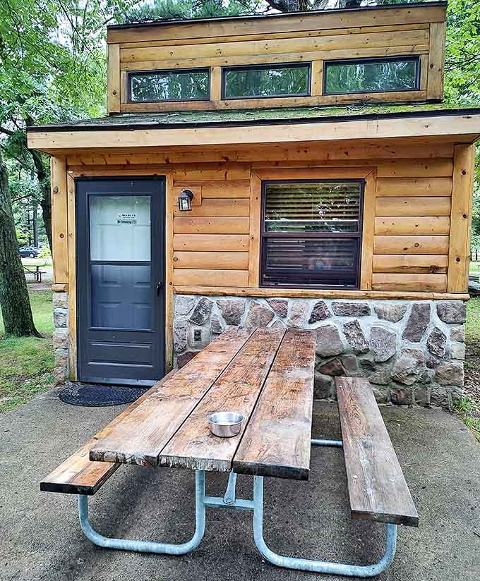 This rustic cabin's wooden picnic table has heard more family stories than most therapists – and charges considerably less.