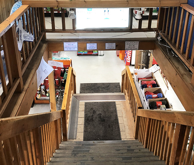 These well-worn wooden steps have carried generations of shoppers between floors, like a retail time machine connecting past and present.