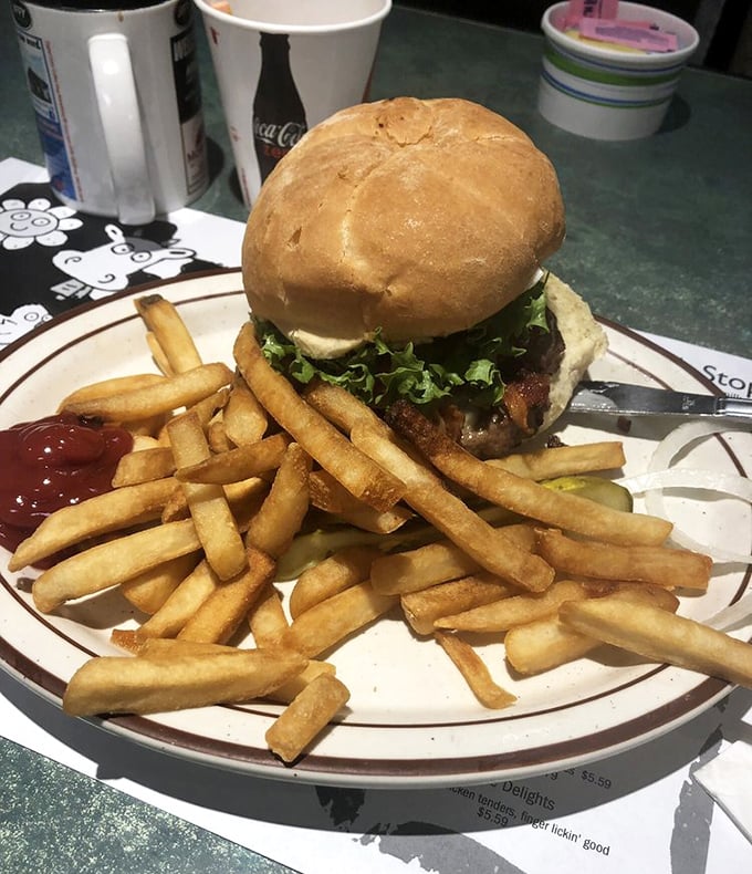 This juicy burger arrives with perfectly golden fries &ndash; proof that truck stop cuisine can rival any restaurant when made with care.