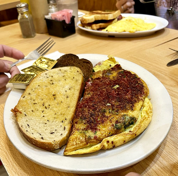 An omelet that puts hotel breakfast buffets to shame &ndash; fluffy, generous, and served with a side of perfectly crisped hash browns.