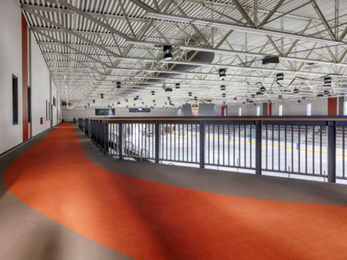 The center's walkway gleams under thoughtful lighting, inviting visitors to discover what lies beyond those welcoming doors.