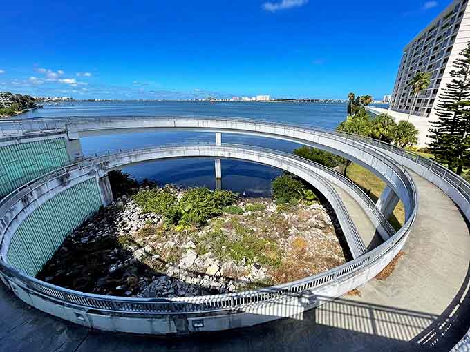The greenway offers a perfect buffer between civilization and serenity, where palm trees stand guard like tropical sentinels.