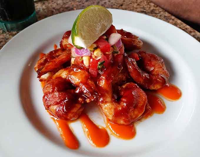 Shrimp glazed and gorgeous, topped with fresh pico and a lime wedge, proving that sometimes the simplest presentations are the most delicious.