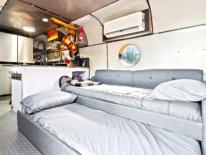 Sweet dreams come easy in this surprisingly cozy trundle bed, where you'll sleep soundly without worrying about turbulence.