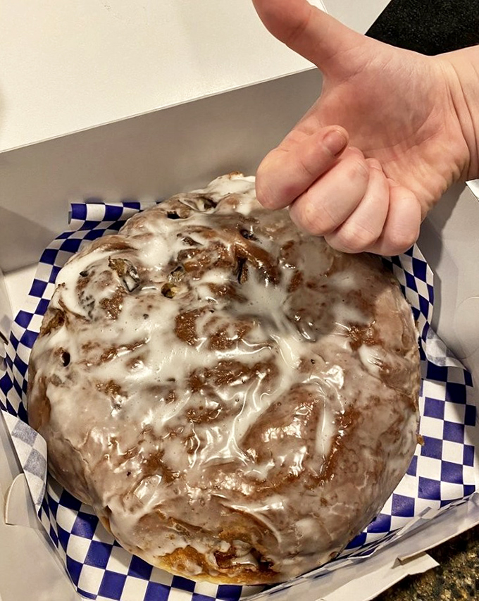 The Apple Fritter sits there like a glazed masterpiece, roughly the size of a dinner plate and twice as tempting.