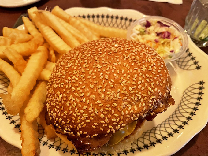 This isn't just any burger &ndash; it's a sesame-seeded masterpiece of beef, bacon and cheese flanked by crispy fries and creamy coleslaw.