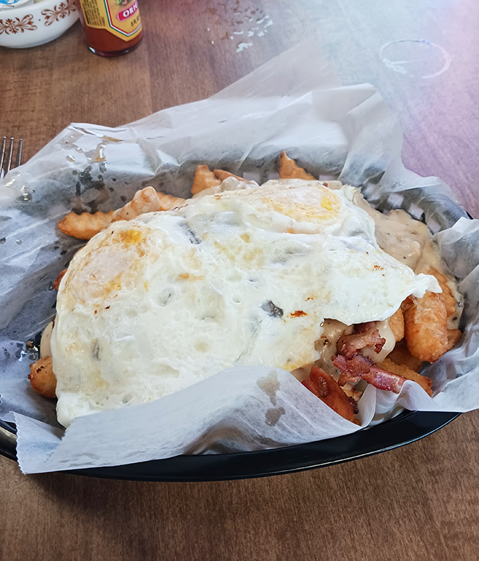 Breakfast poutine that borders on the divine—crispy fries, savory toppings, and eggs creating a morning indulgence worth every calorie.