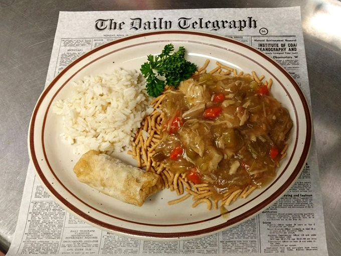 Chicken chow mein served atop steaming rice with crispy noodles &ndash; a Midwestern interpretation of Chinese cuisine that's become a beloved tradition in its own right.