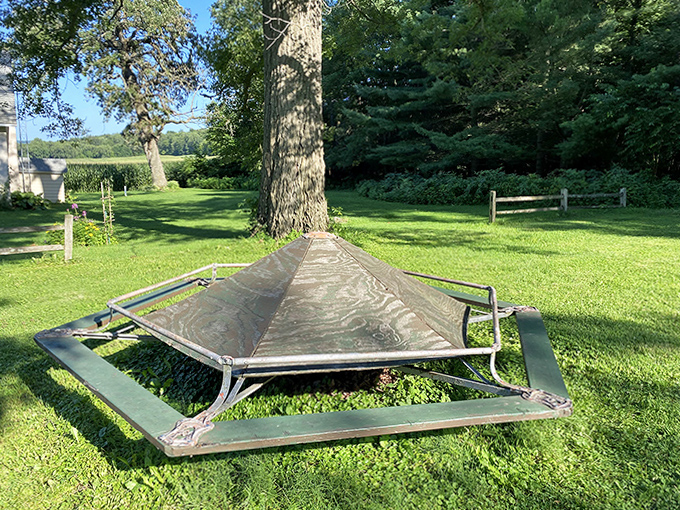 This curious metal structure stands sentinel near the park, its purpose as mysterious to casual visitors as the mound itself.