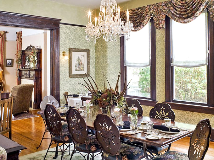 Dining becomes theater in this elegant room where ornate chairs and crystal chandeliers set the stage for memorable meals.