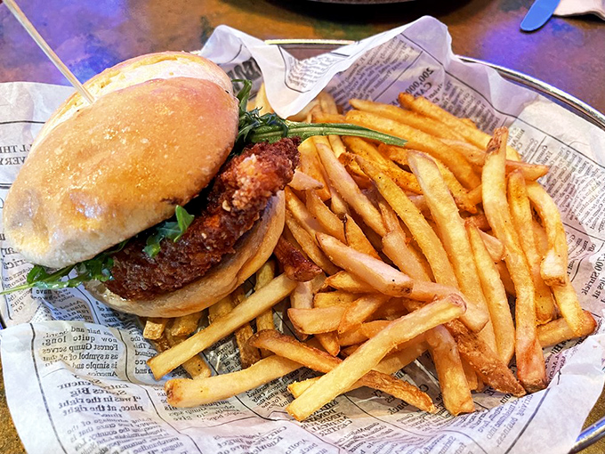 This Paleozoic Chicken Sandwich isn't your average lunch &ndash; it's a handheld flavor expedition served with a mountain of crispy fries.