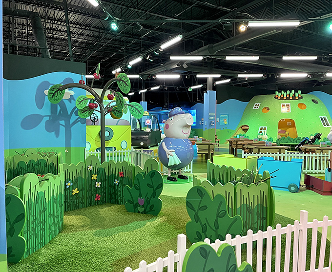 White picket fences and vibrant play structures create boundaries that are more suggestion than limitation in this world of boundless imagination.